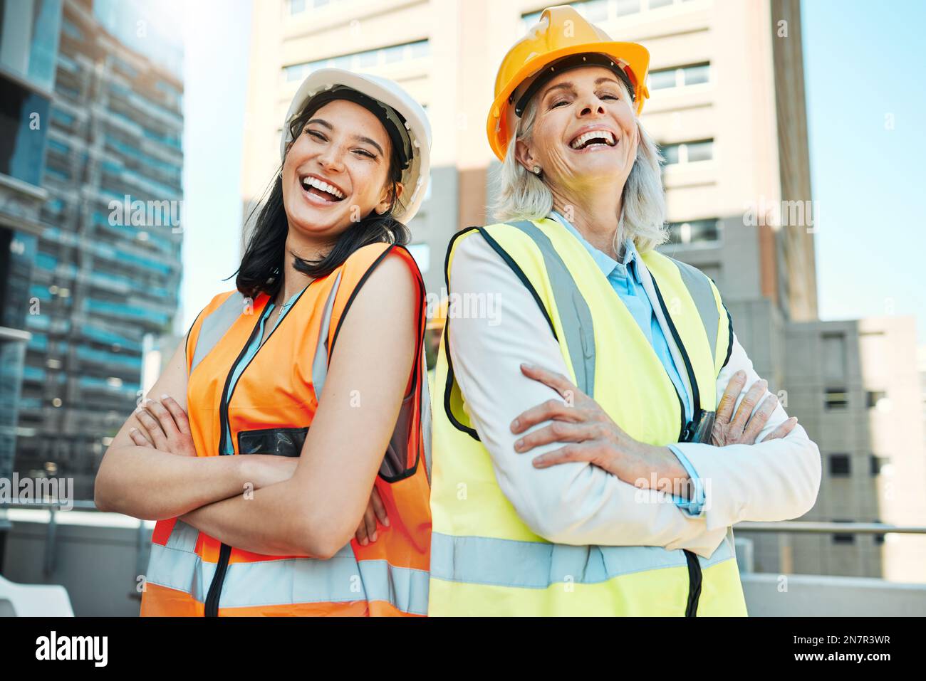 Women taking over the construction business. two contractors standing ...