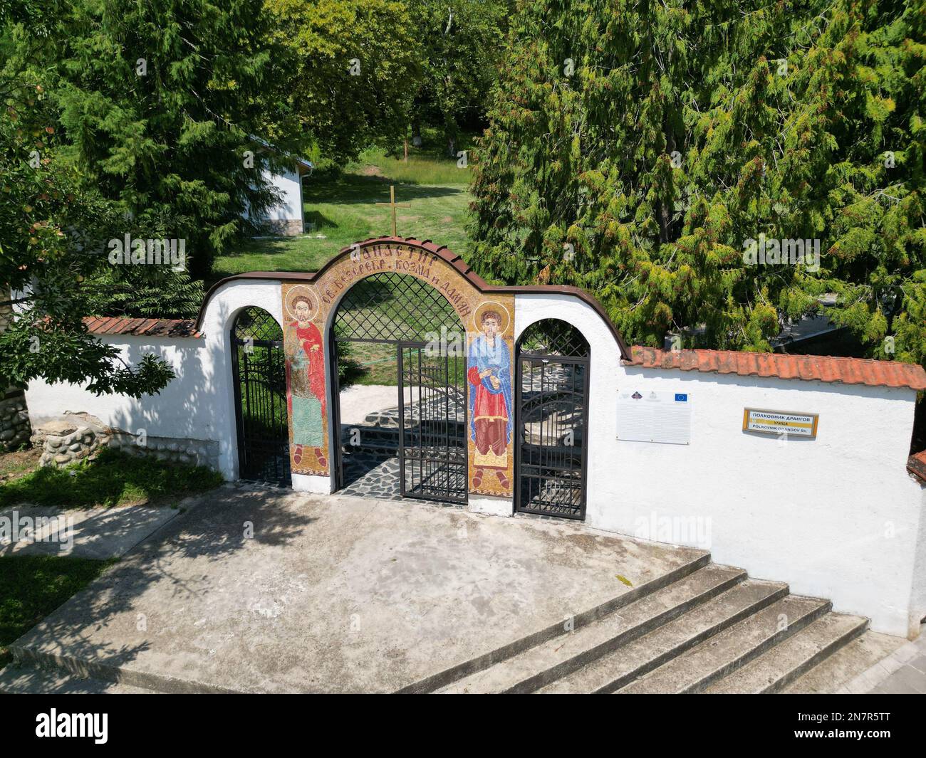 An aerial shot of the gates of an Orthodox Monastery with painintings ...