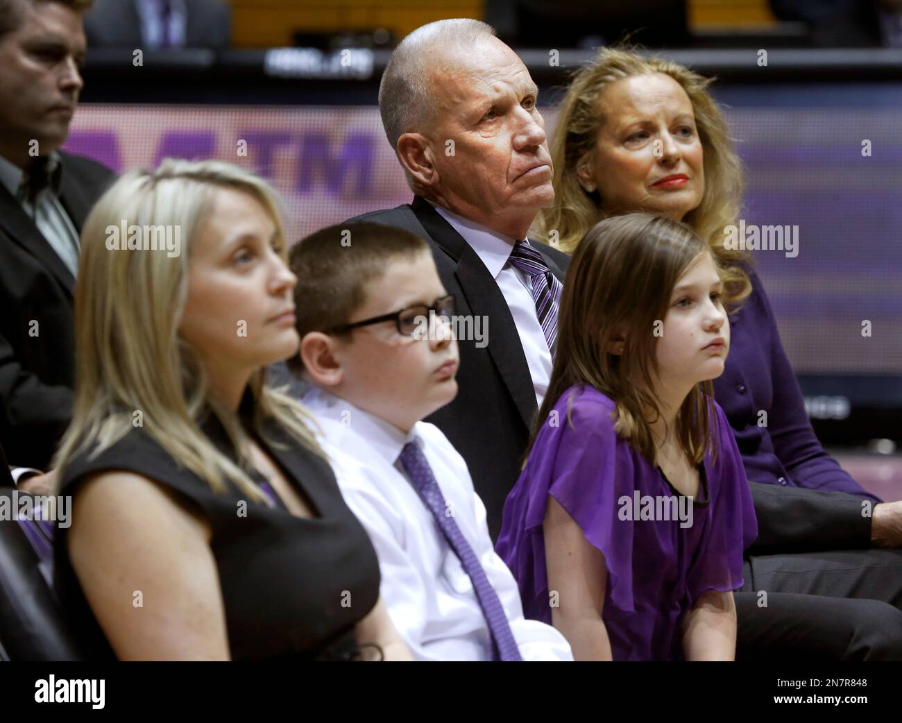 Philadelphia 76ers head coach Doug Collins, center, sits with his ...