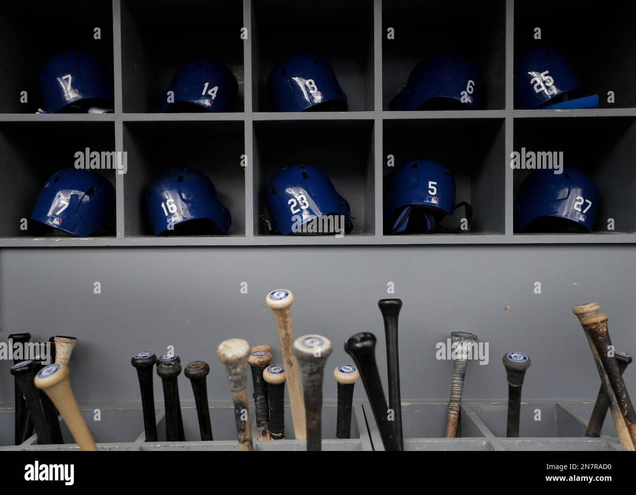 Helmets and bats are seen in the dugout before a season-opening ...