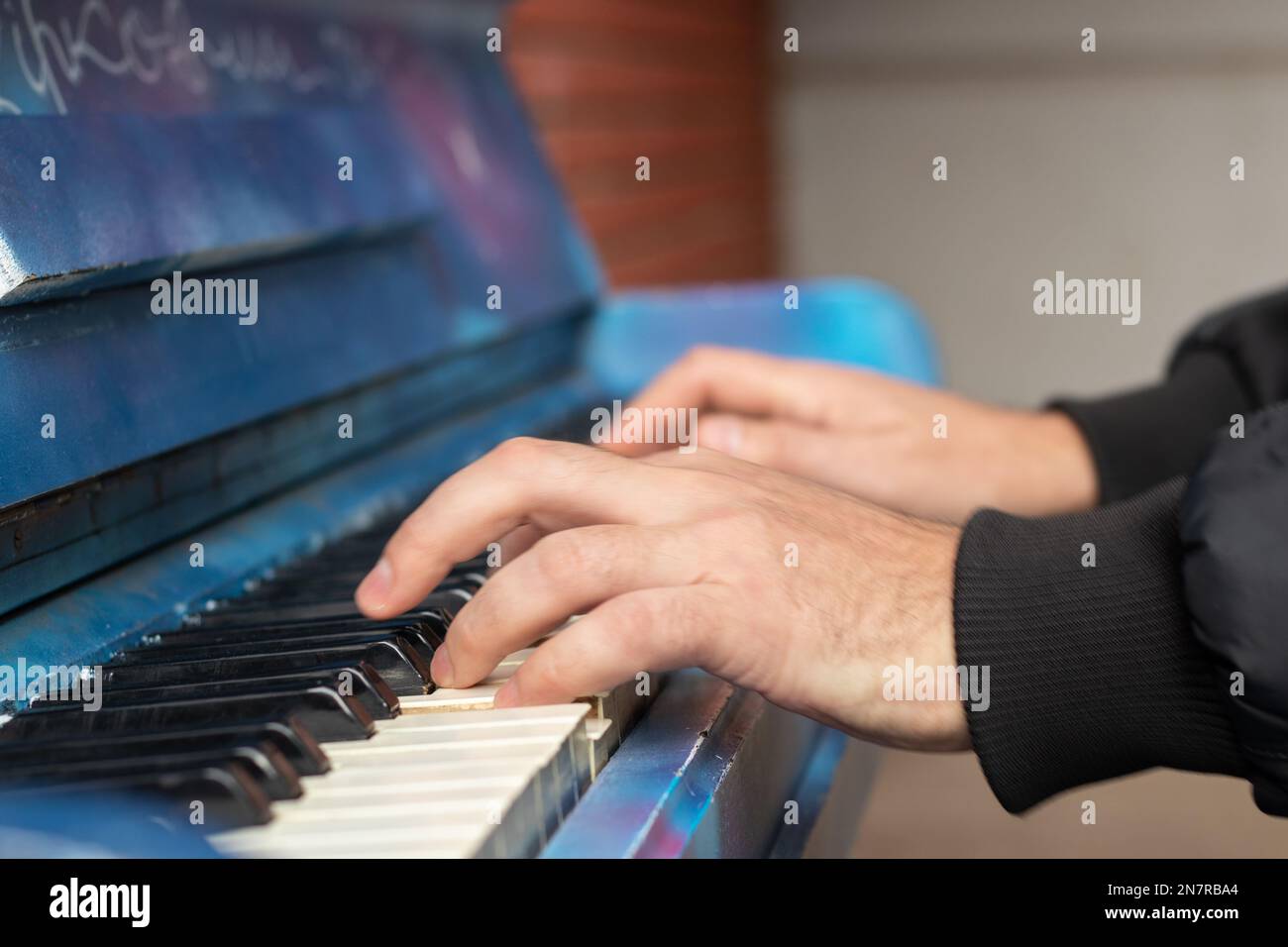 male hands on the piano close up, musical instrument Stock Photo - Alamy
