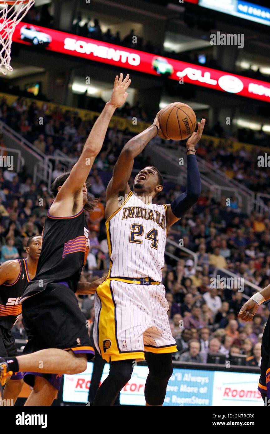 Indiana Pacers' Paul George, right, against Phoenix Suns' Luis Scola ...