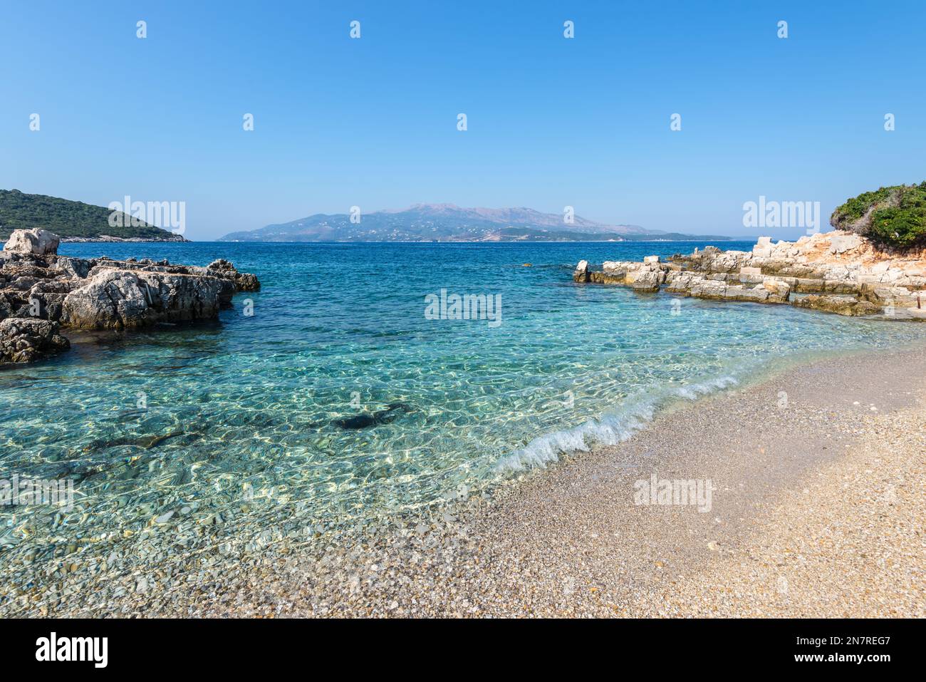 Amazing empty beach between the Twin Islands of Ksamil in Albania ...