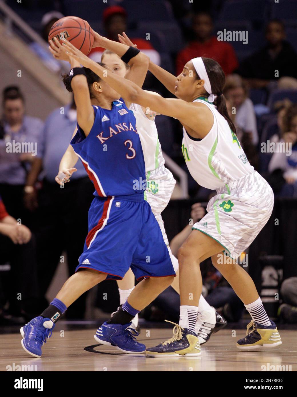 Notre Dame guard Skylar Diggins, right, pressures Kansas guard Angel ...