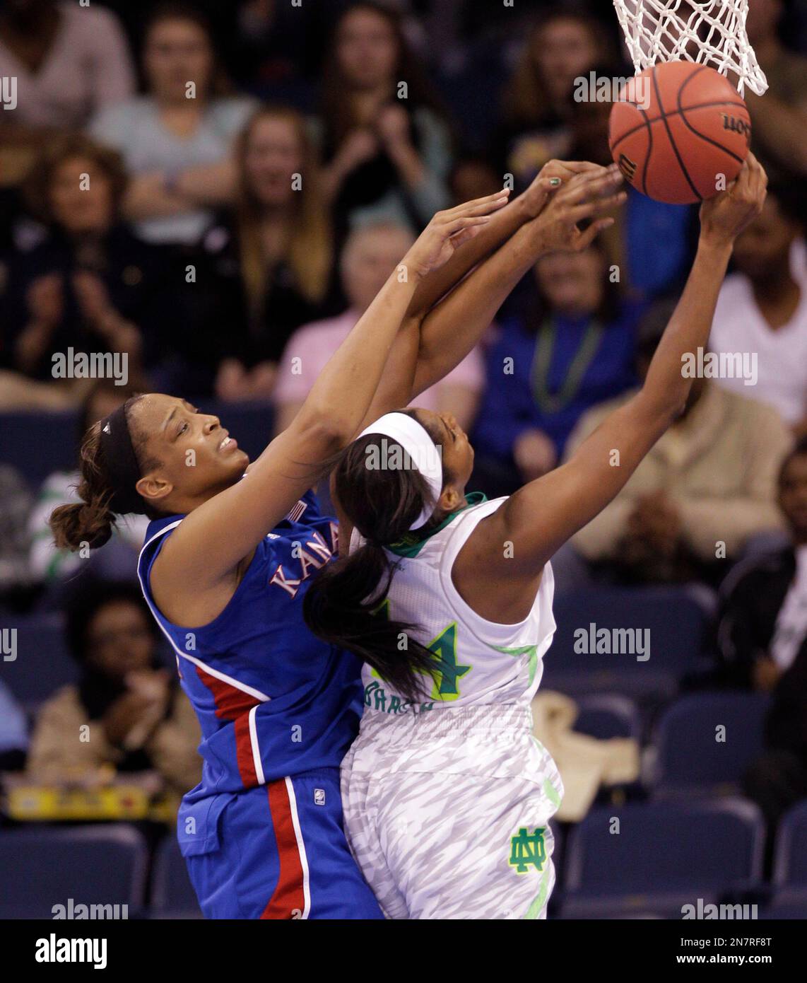 Kansas forward Carolyn Davis, left, and Notre Dame forward Ariel Braker ...