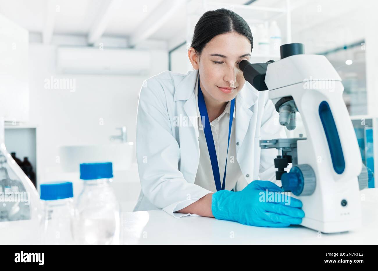 Experiments play many roles in science. a young scientist using a ...