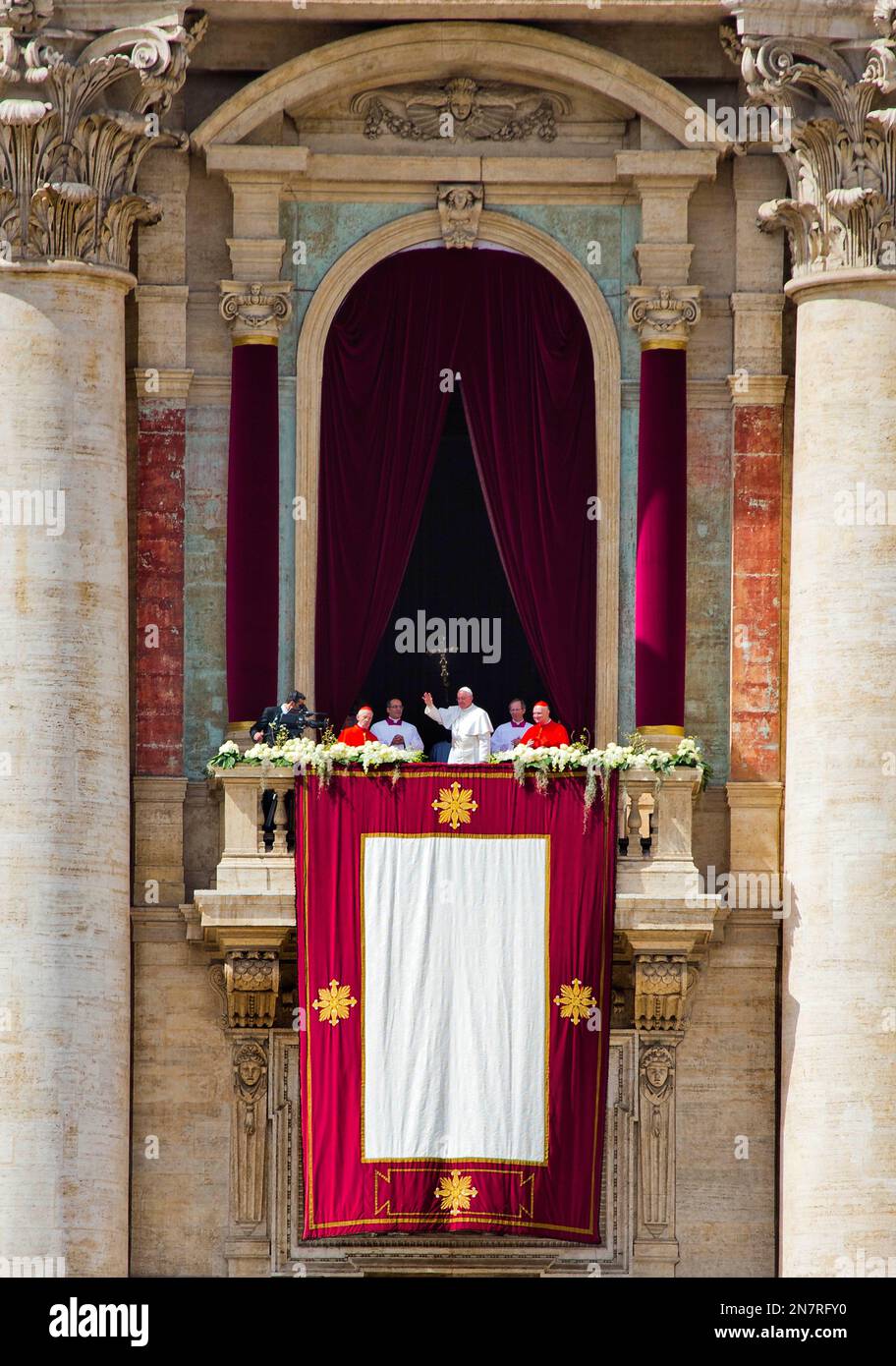 Pope Francis waves from the loggia of the St. Peter's Basilica to the ...