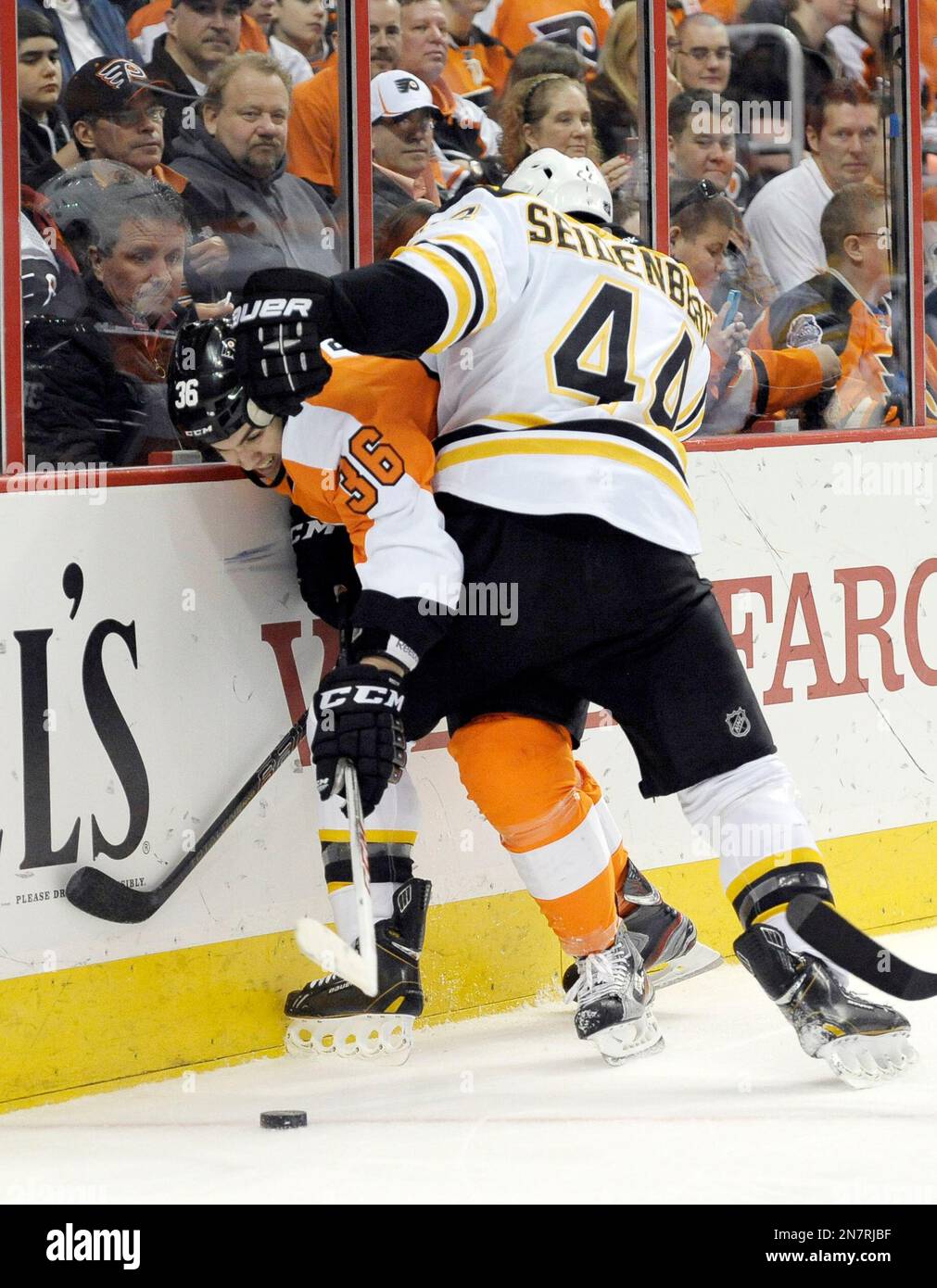 Boston Bruins' Dennis Seidenberg (44), of Germany, checks Philadelphia ...