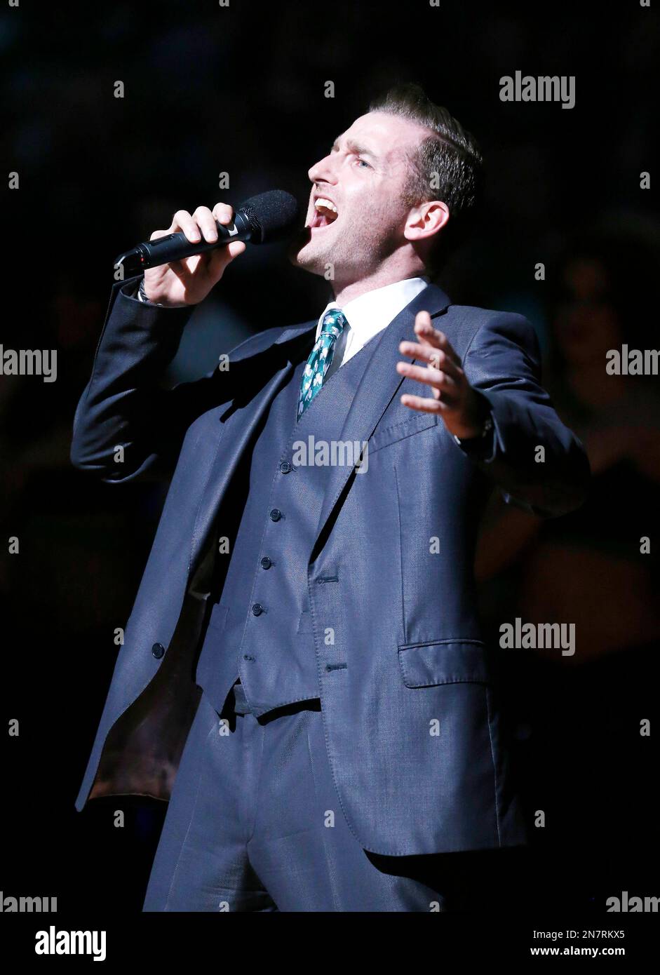 Irish tenor Paul Byrom sings the national anthem before an NBA ...