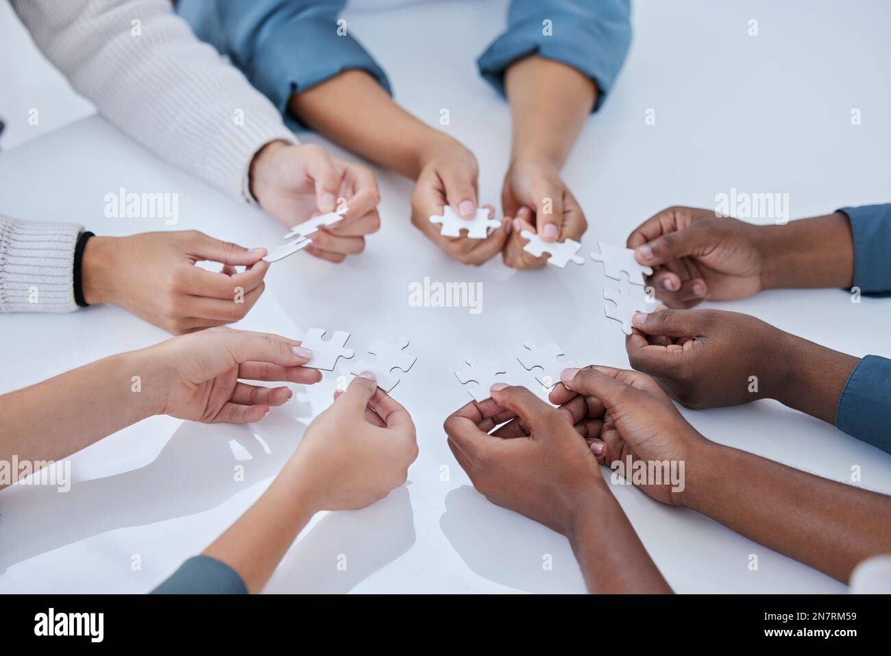 Business people, hands and puzzle in team building for planning ...