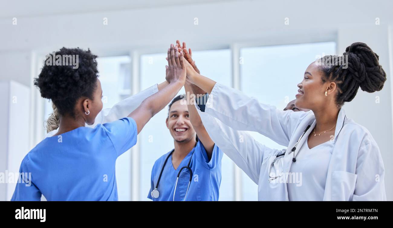 Success, high five and teamwork with doctors in hospital cheering for ...