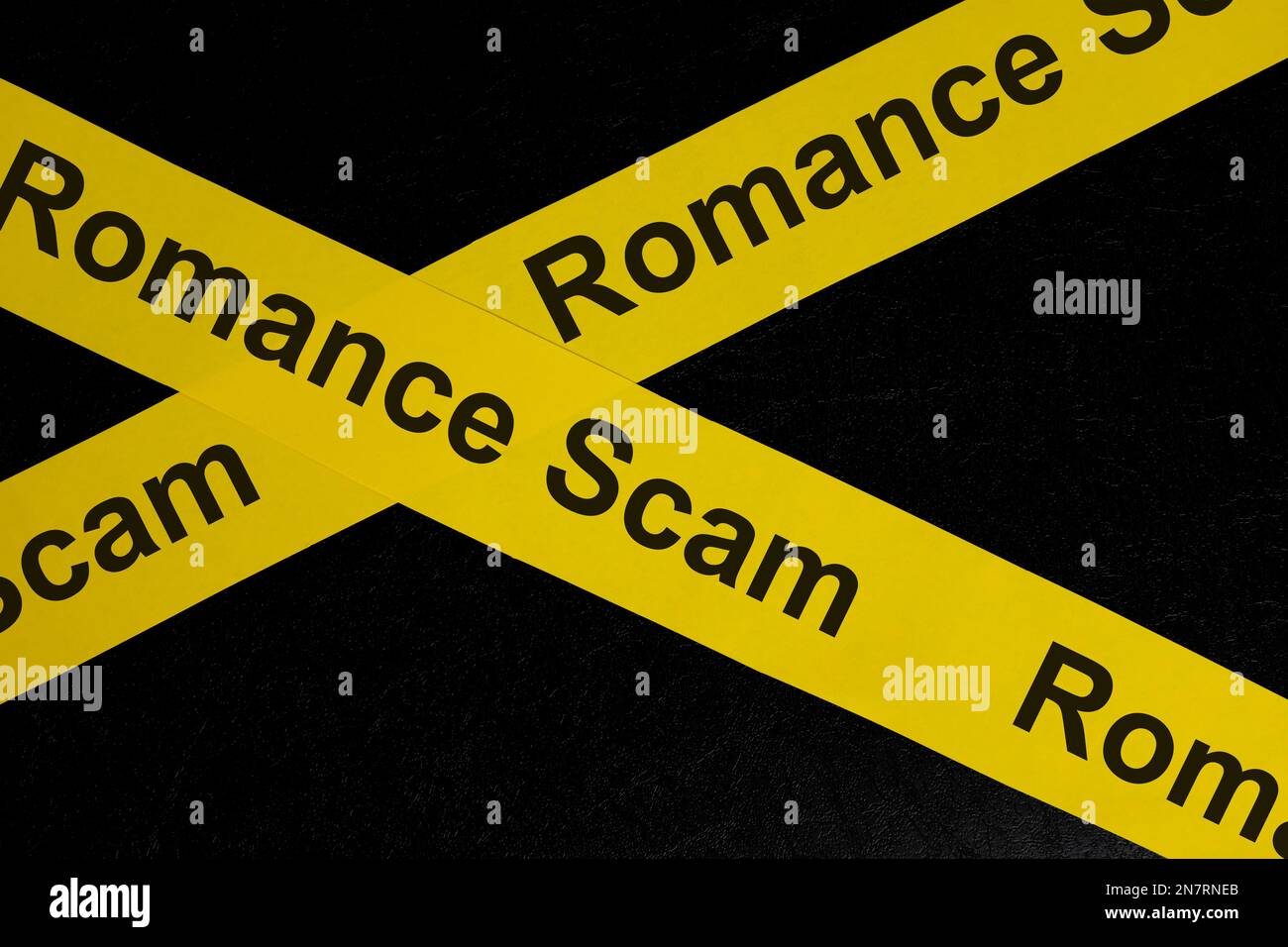 Romance scam alert, caution and warning concept. Yellow barricade tape ...