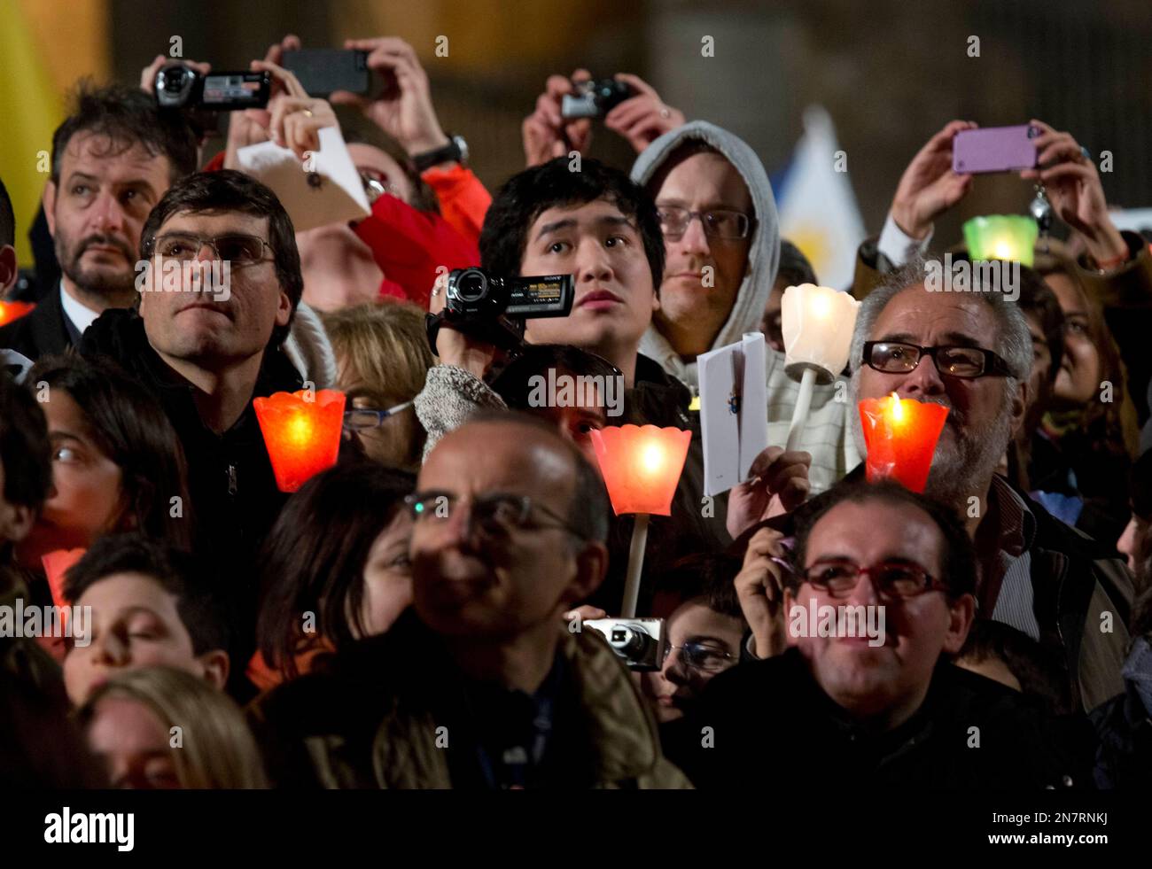 Faithful look at Pope Francis, not pictured, arriving to preside the ...