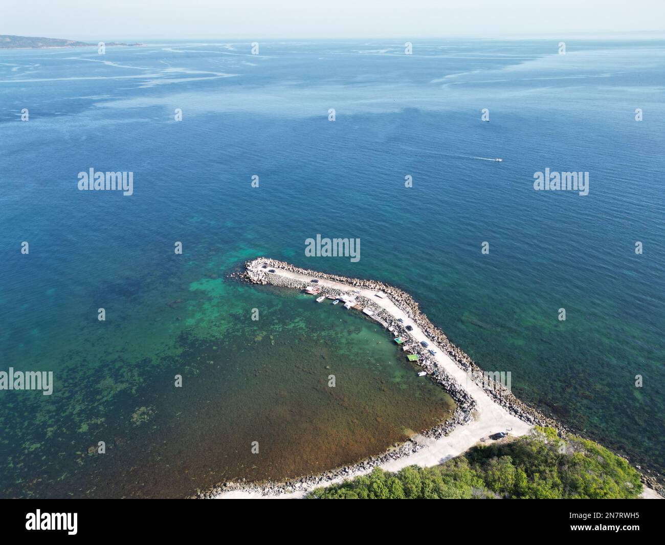 An aerial shot of the harbor of the coastal town of Primorsko with cars ...