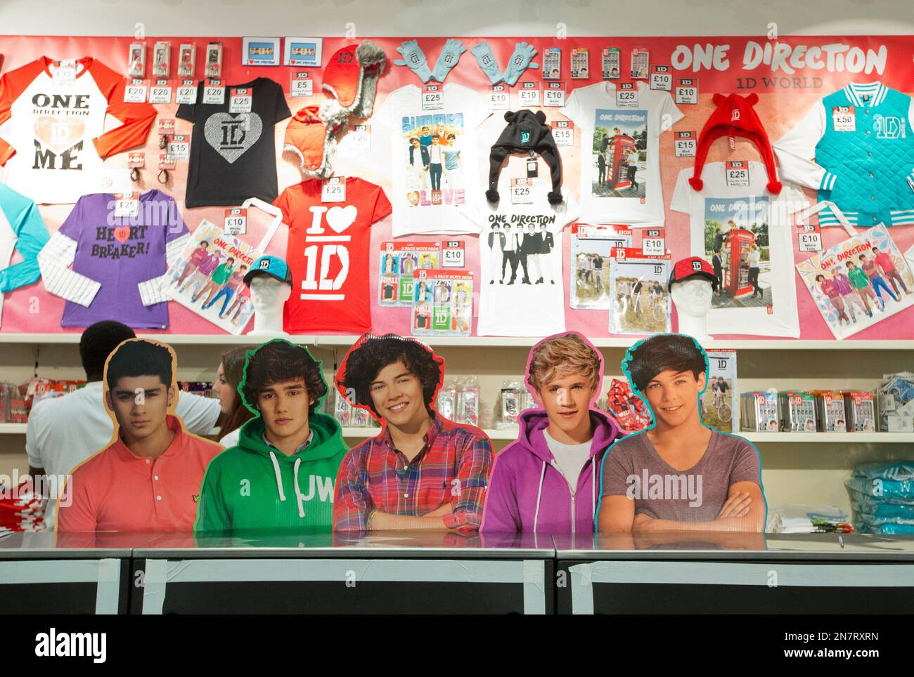 Cardboard cut-outs of One Direction band members are on display at a ...