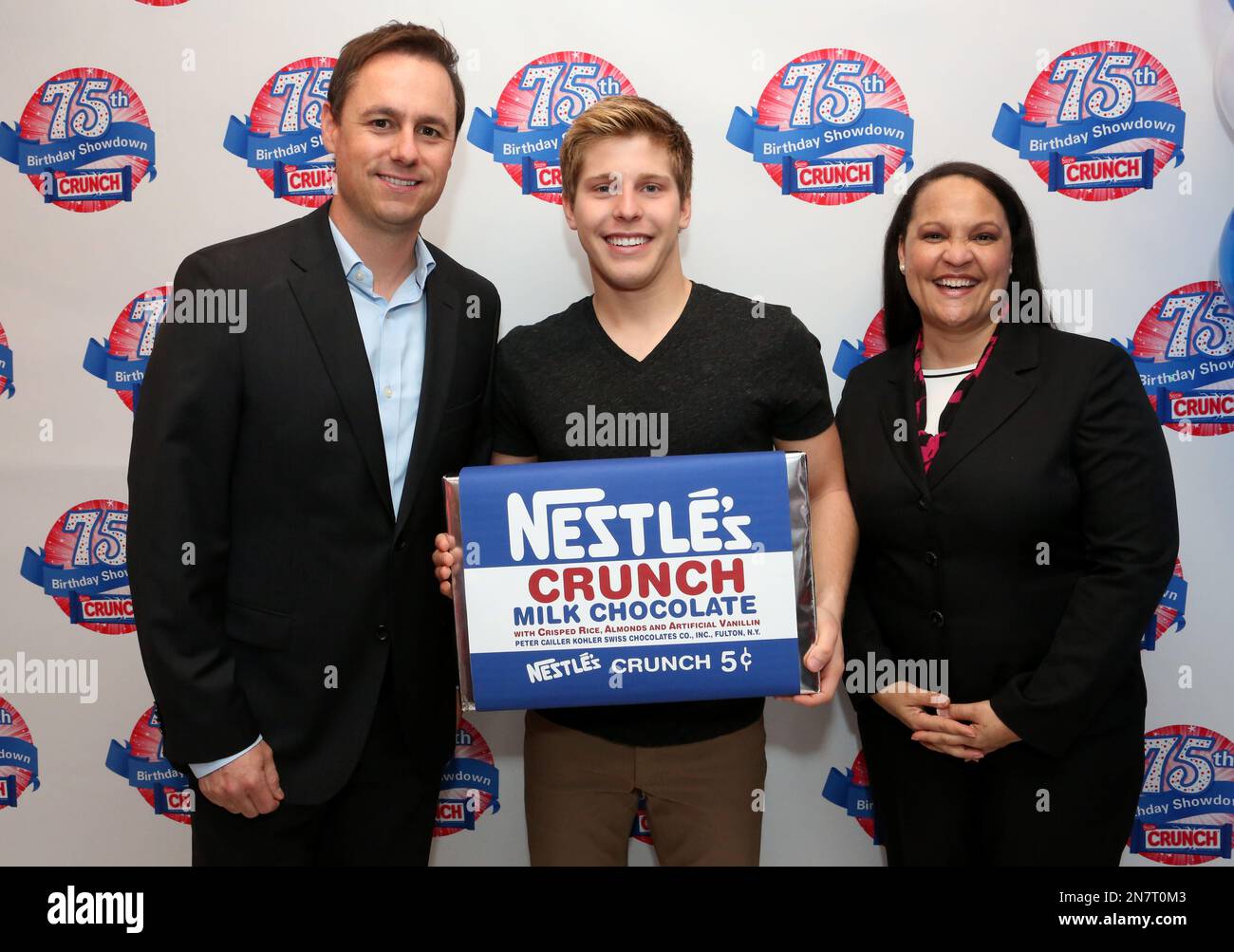 From left, Matt Biggins, Nestle Crunch brand manager, actor Thomas Kasp ...