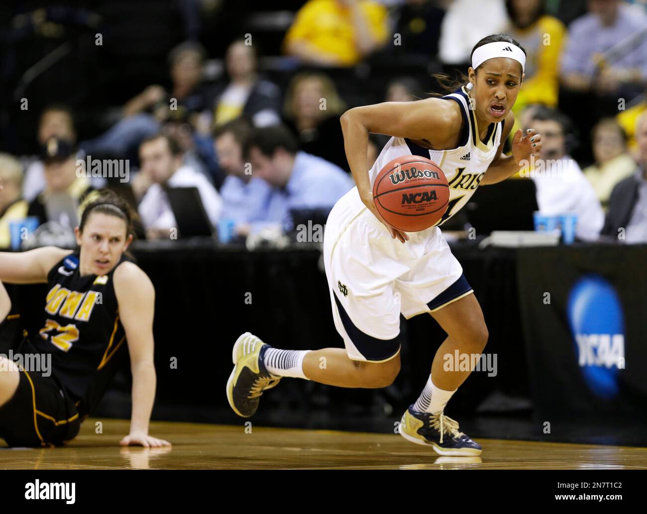 Notre Dame guard Skylar Diggins, right, steals the ball from Iowa guard ...
