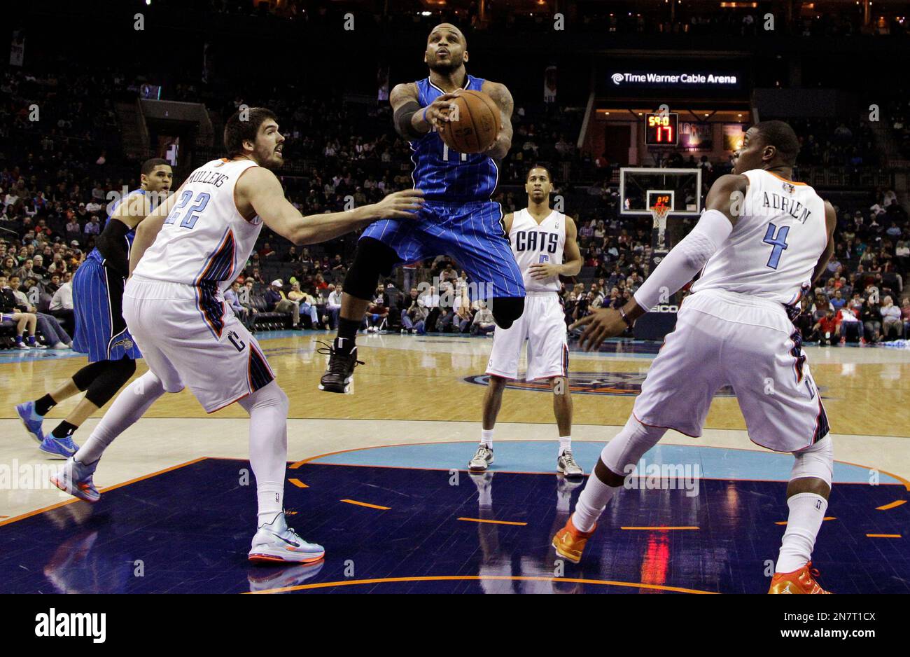 Orlando Magic's Jameer Nelson, center, drives between Charlotte Bobcats ...