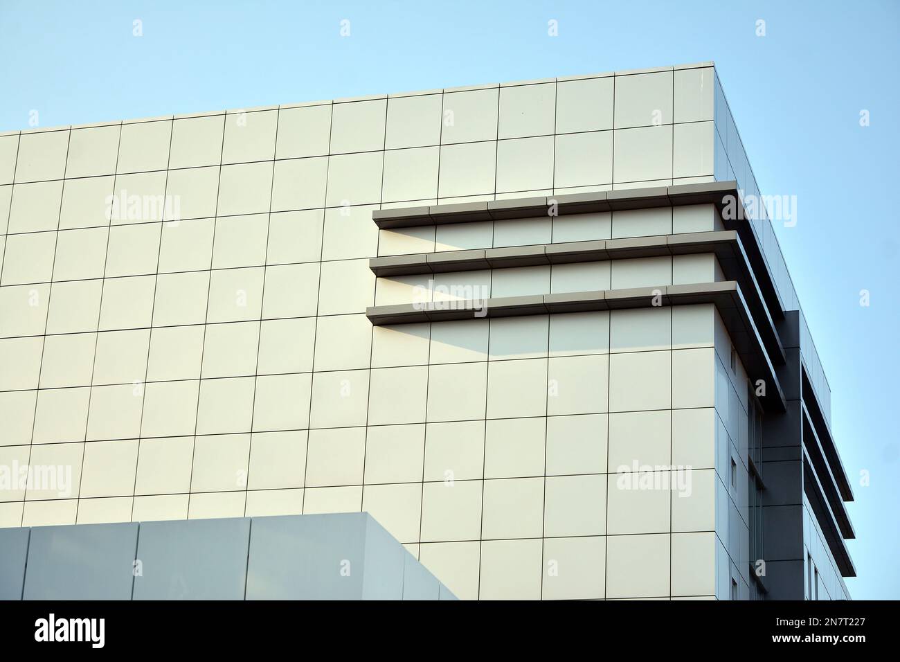 Wall of a modern commercial building with aluminum metal composite ...