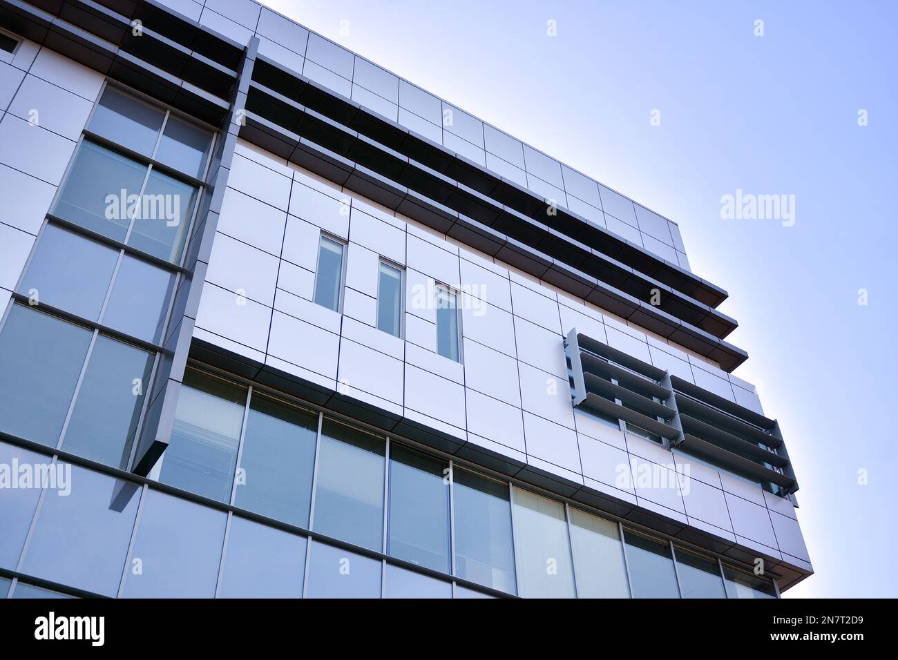 Wall of a modern commercial building with aluminum metal composite ...