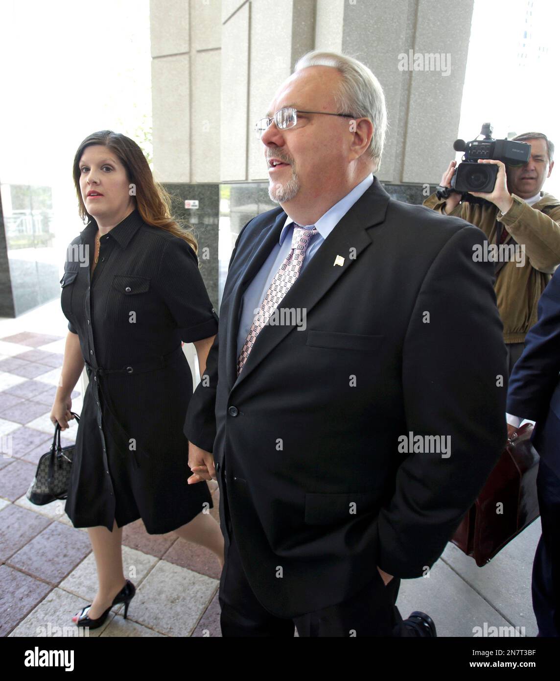Former Florida GOP chairman Jim Greer, right front, arrives at the ...