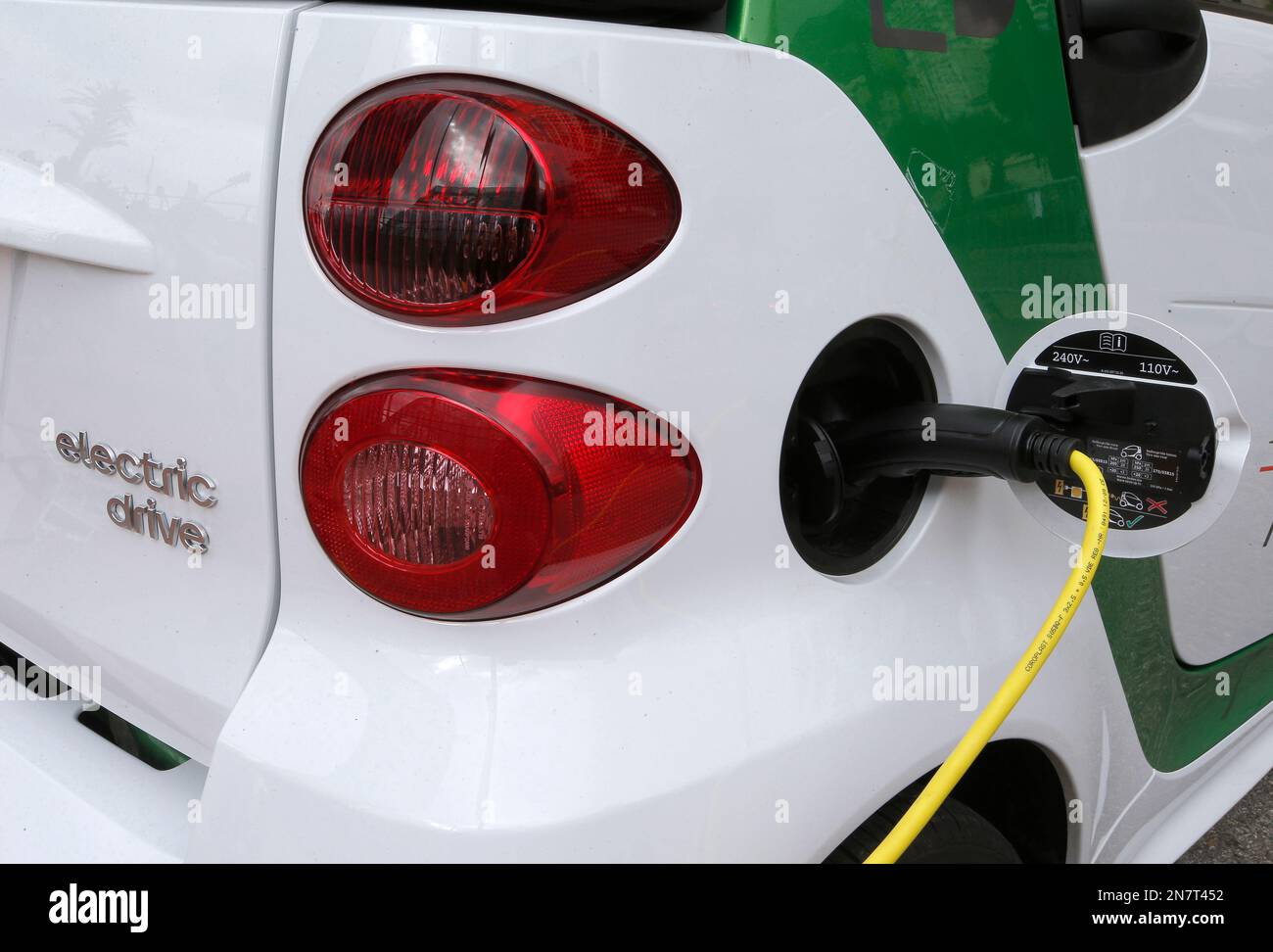 An electric plug of a "Smart fortwo "electric car, is showing at the ...