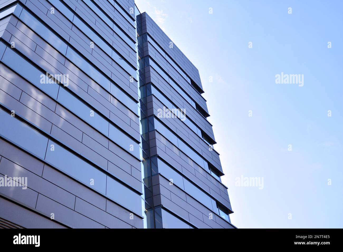 Wall of a modern commercial building with aluminum metal composite ...