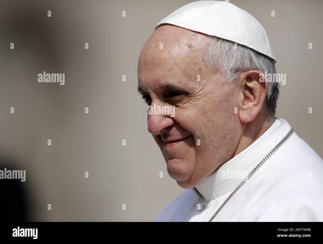 Pope Francis is driven through the crowd during his general audience ...