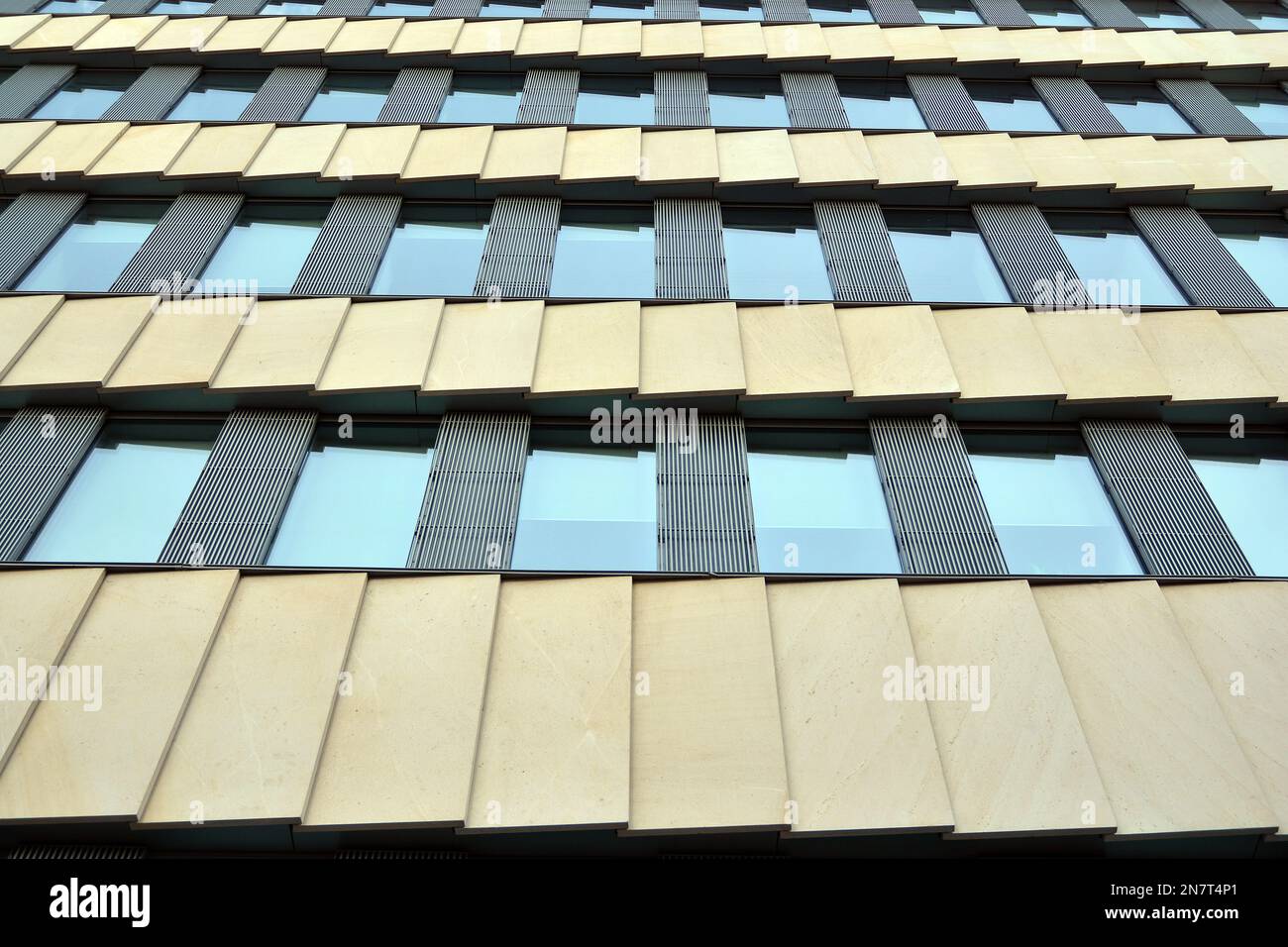 Wall of a modern commercial building with aluminum metal composite ...