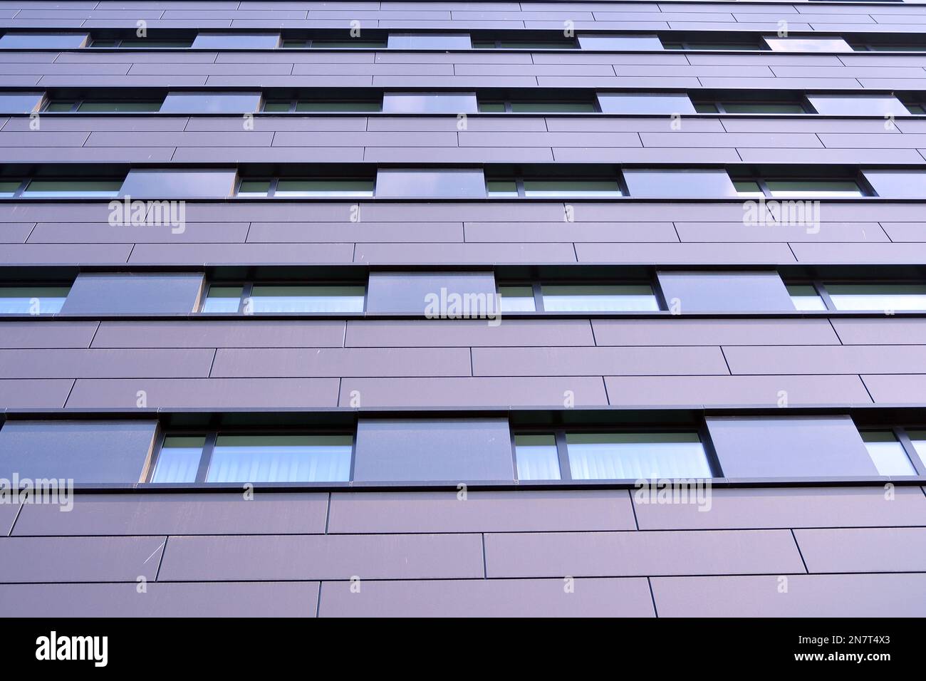 Wall of a modern commercial building with aluminum metal composite ...