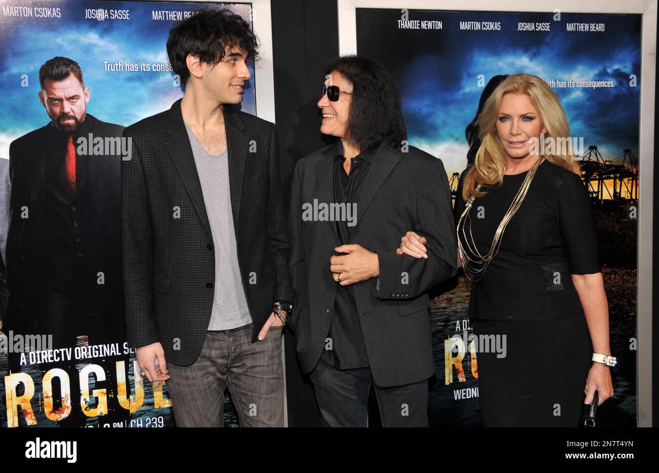 Gene Simmons poses with his son Nick and wife Shannon Tweed at the Los ...