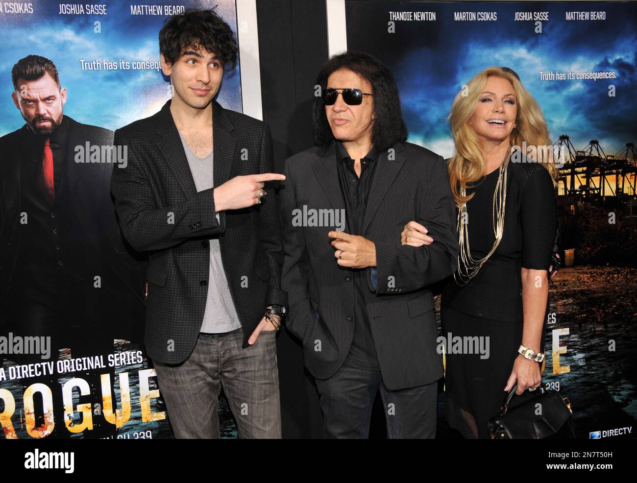 Gene Simmons poses with his son Nick and wife Shannon Tweed at the Los ...