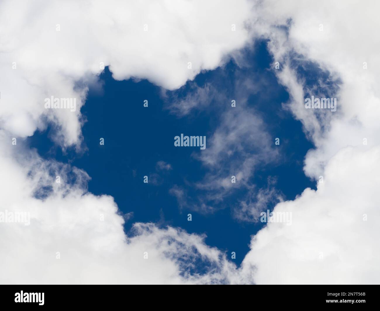 blue sky with heart shaped clouds, negative space Stock Photo - Alamy