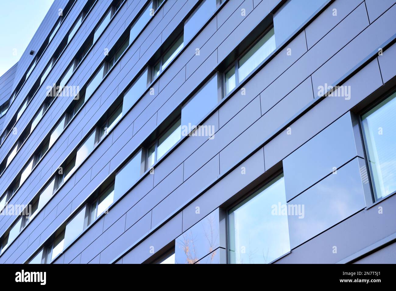 Wall of a modern commercial building with aluminum metal composite ...