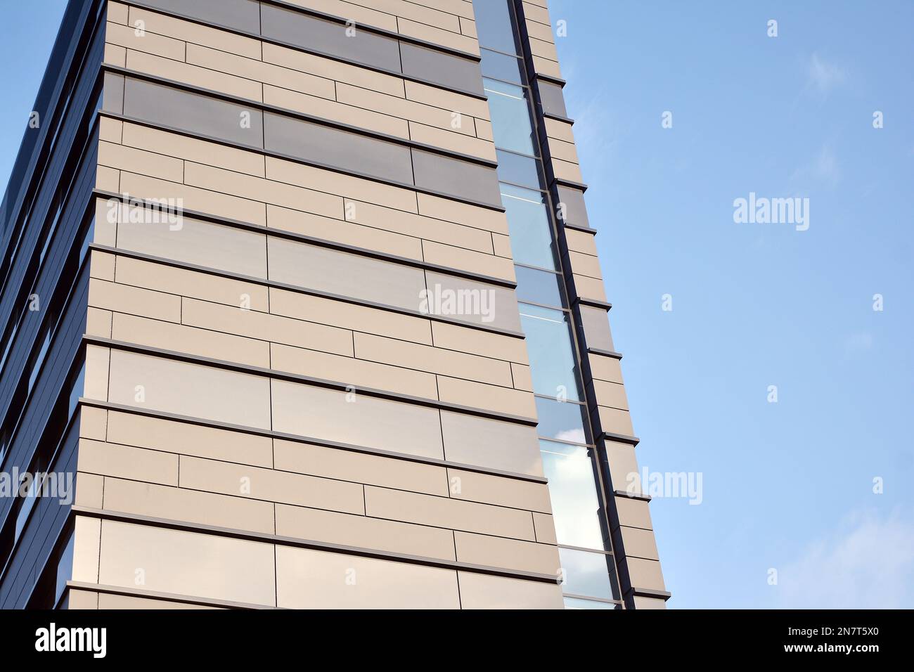 Wall of a modern commercial building with aluminum metal composite ...