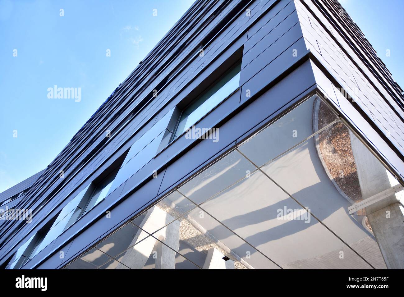 Wall of a modern commercial building with aluminum metal composite ...