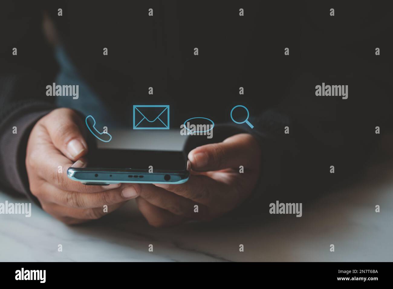 Contact us, businessman hand holding mobile smartphone with letter ...