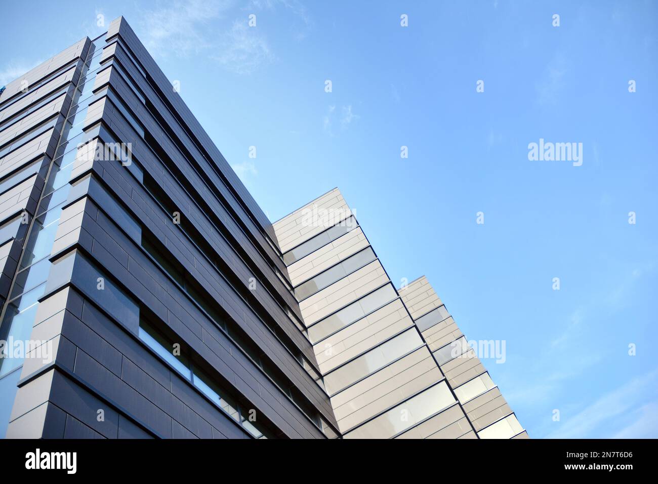 Wall of a modern commercial building with aluminum metal composite ...