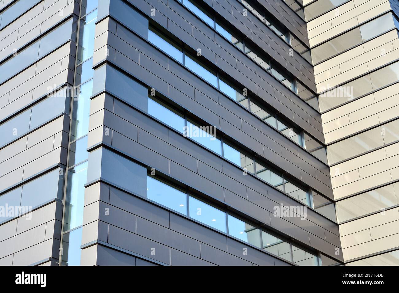 Wall of a modern commercial building with aluminum metal composite ...