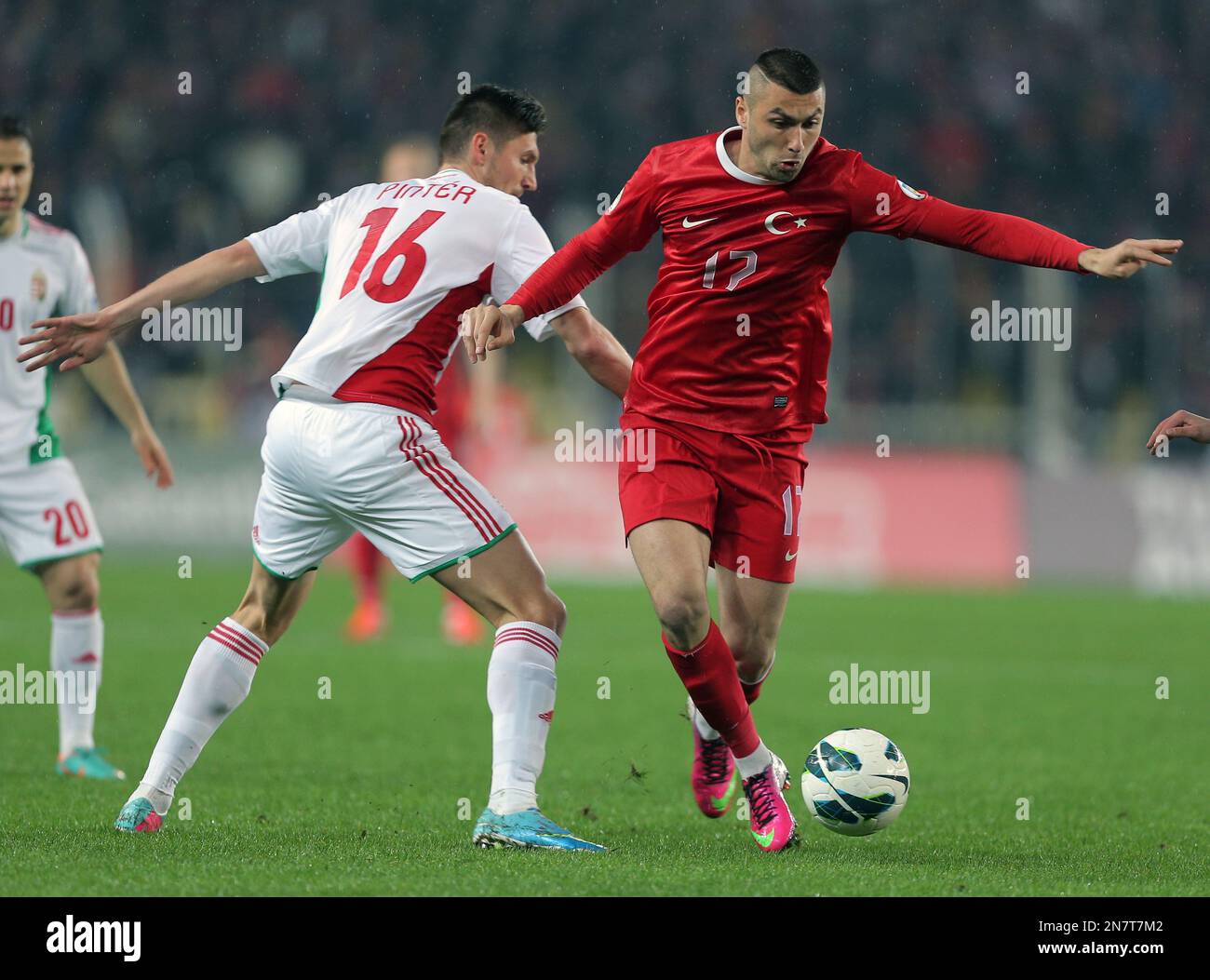 Turkey's Burak Yilmaz, right, and Adam Pinter of Hungary fight for the ...