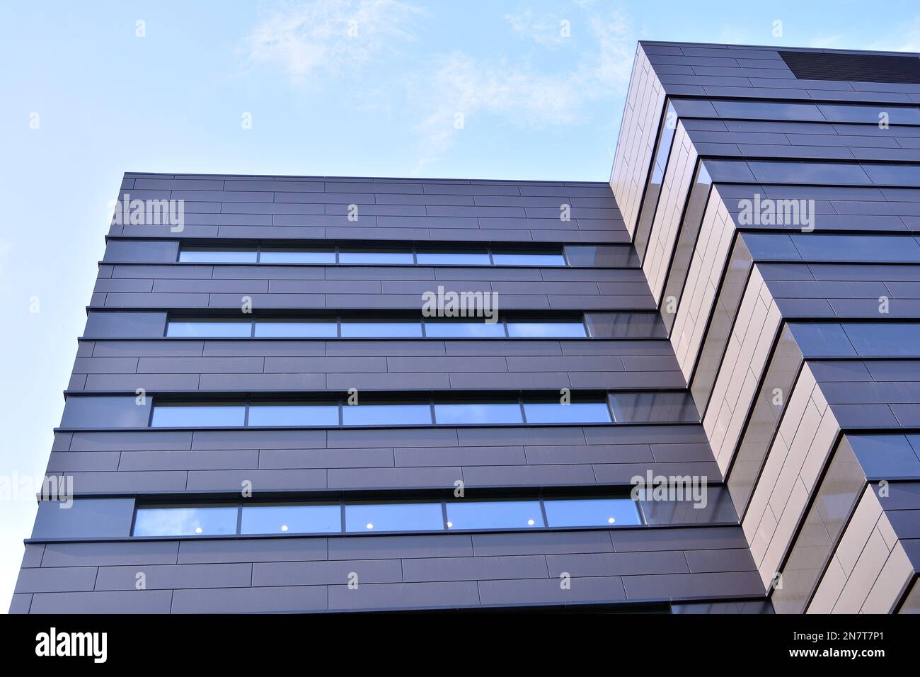 Wall of a modern commercial building with aluminum metal composite ...