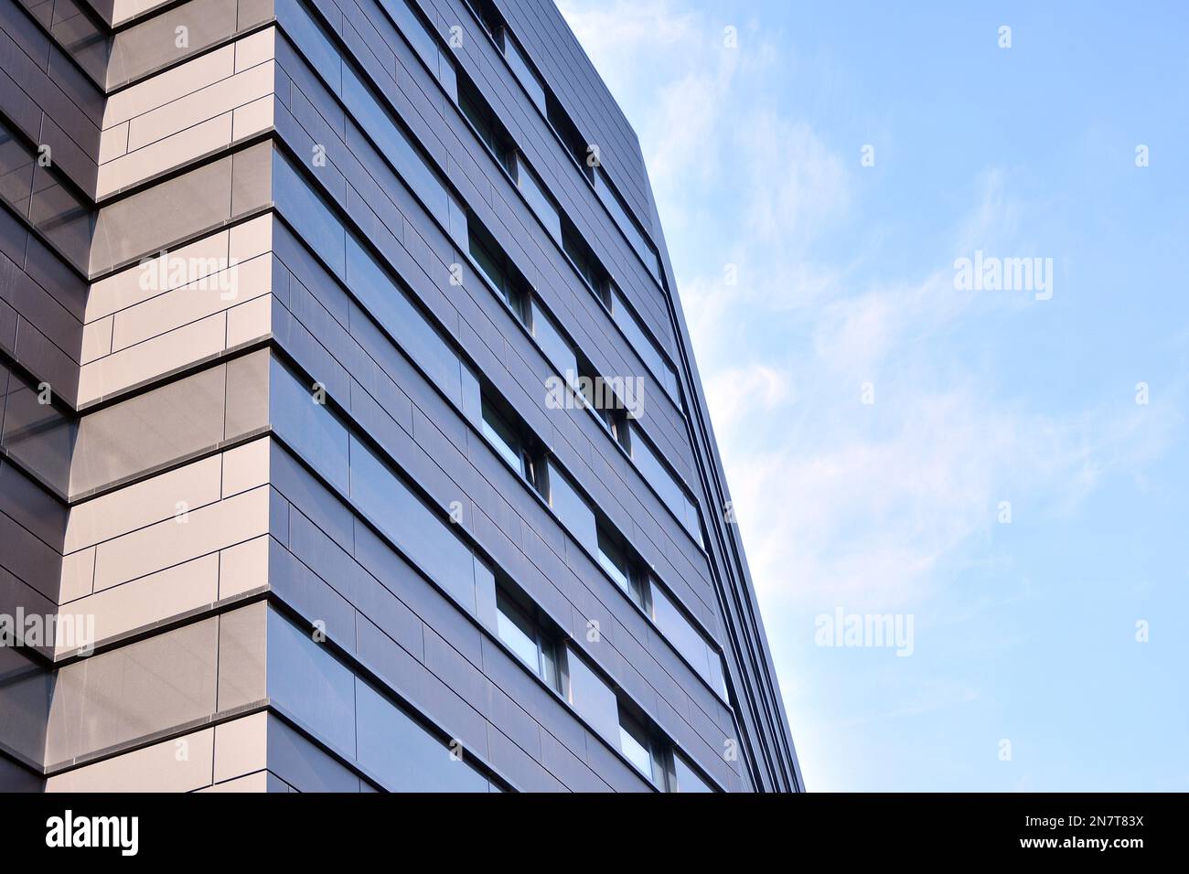 Wall of a modern commercial building with aluminum metal composite ...