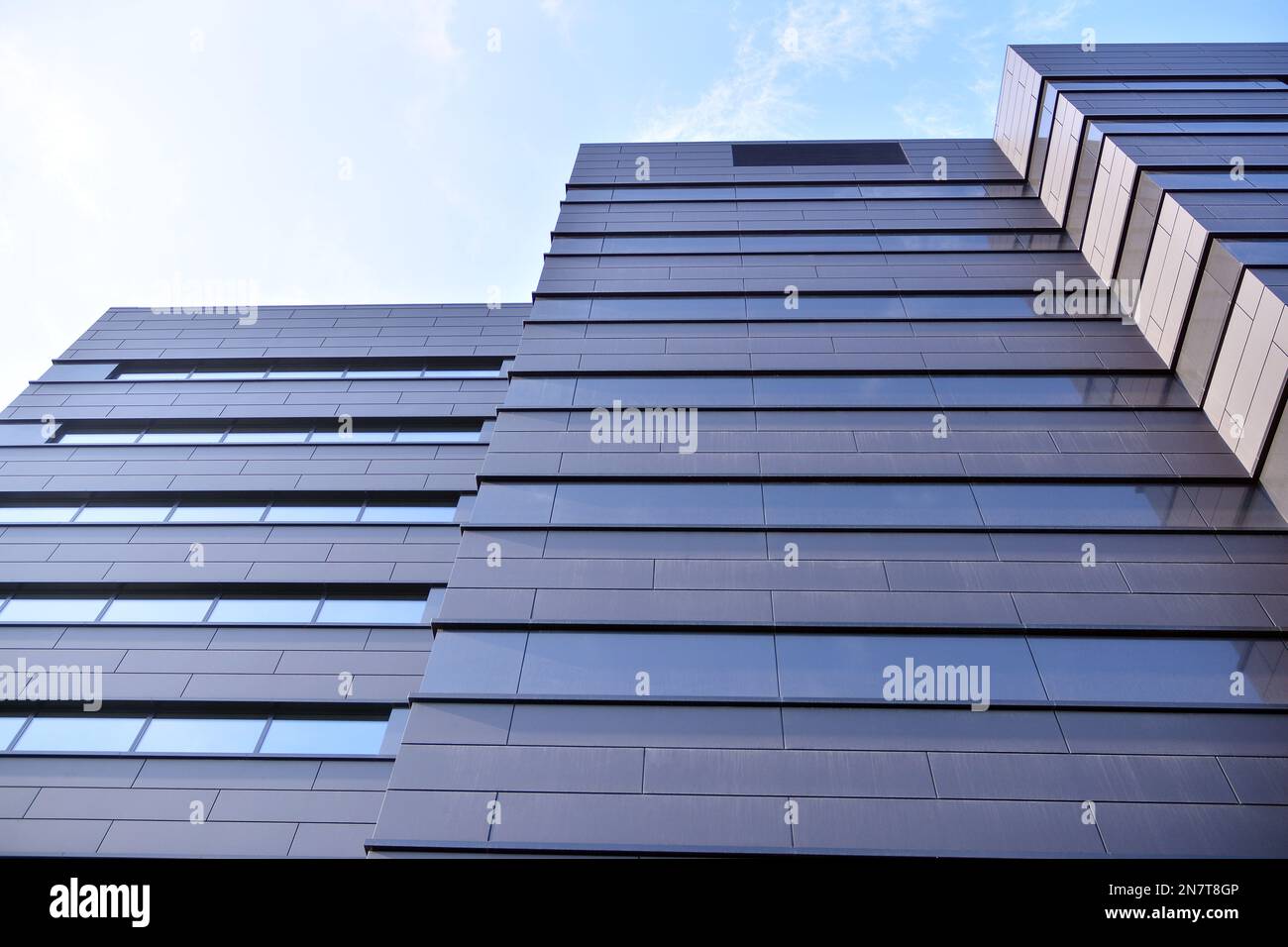 Wall of a modern commercial building with aluminum metal composite ...
