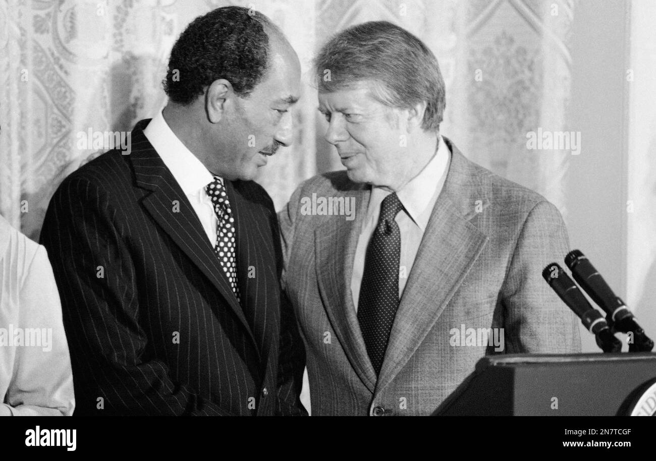 Egyptian President Anwar Sadat, left, and President Jimmy Carter face ...