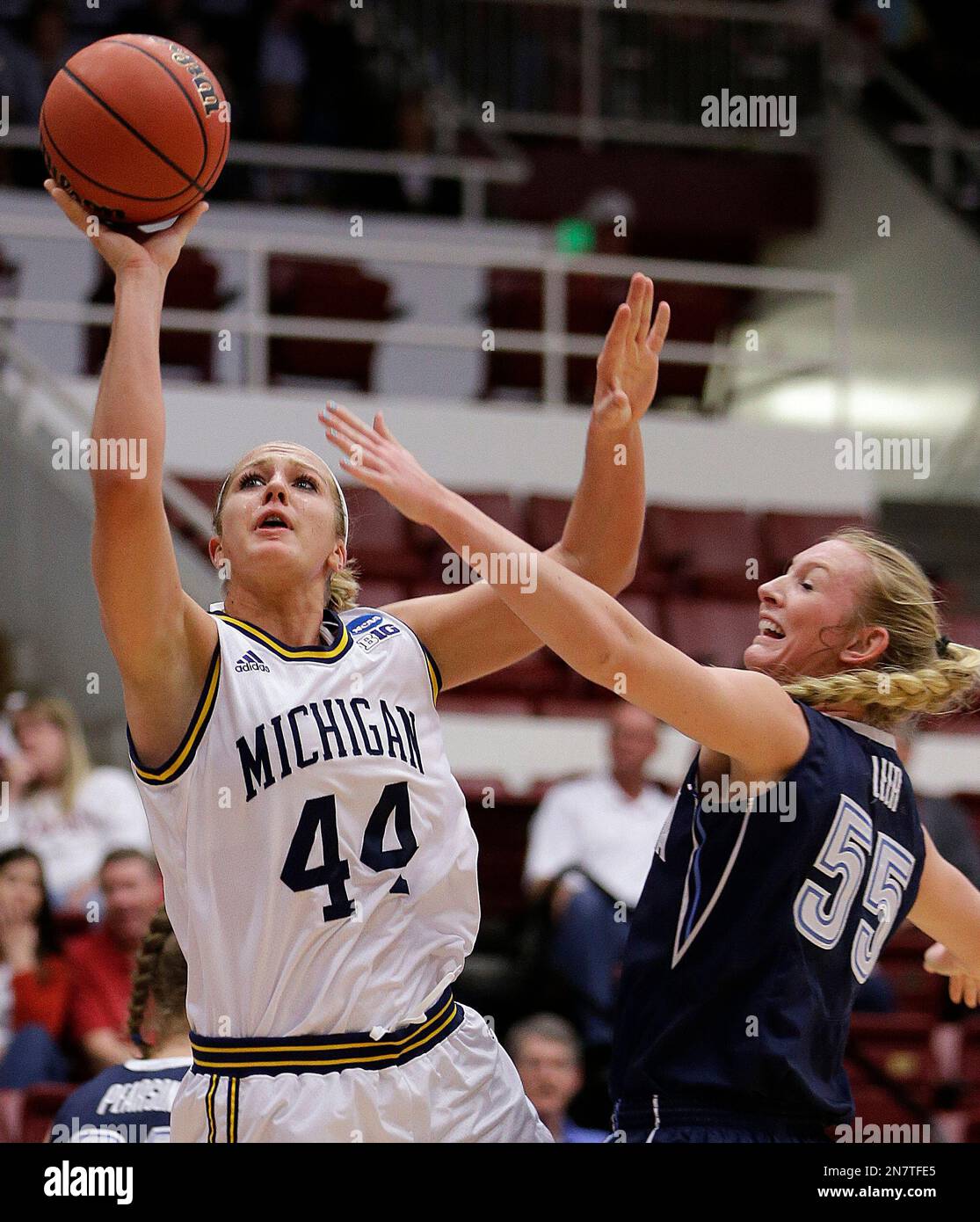 Michigan's Rachel Sheffer, left, shoots against Villanova's Emily Leer ...