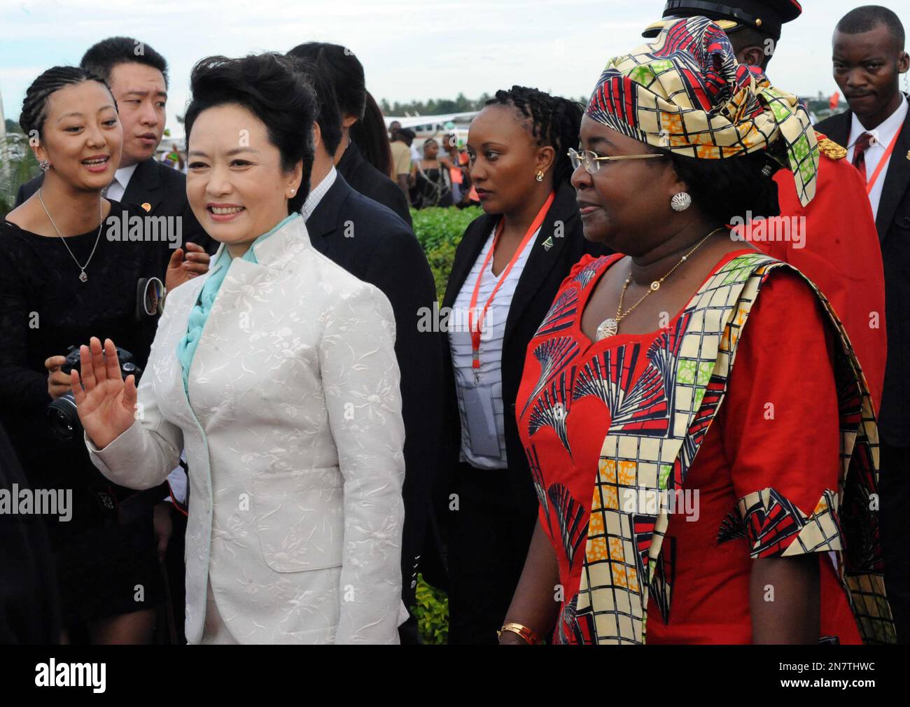 Chinese First Lady, Madame Peng Liyuan, left,, waves as she is ...