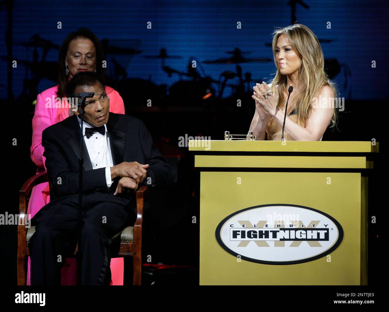 Actress and entertainer Jennifer Lopez, right, applauds at Muhammad Ali ...