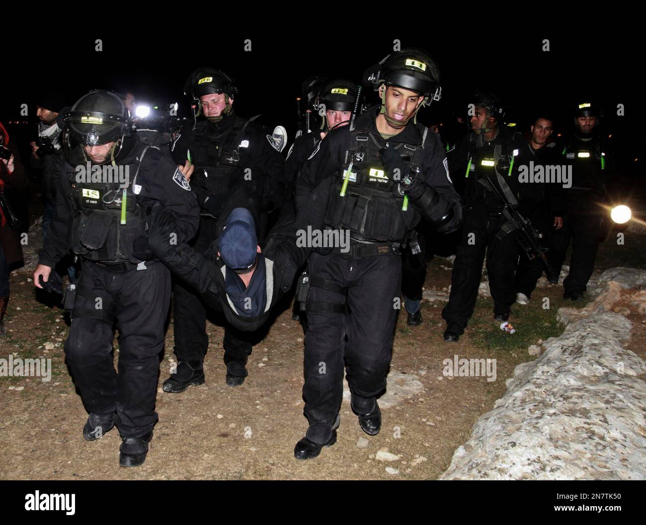 Israeli border policemen evict a Palestinian activist from an area ...