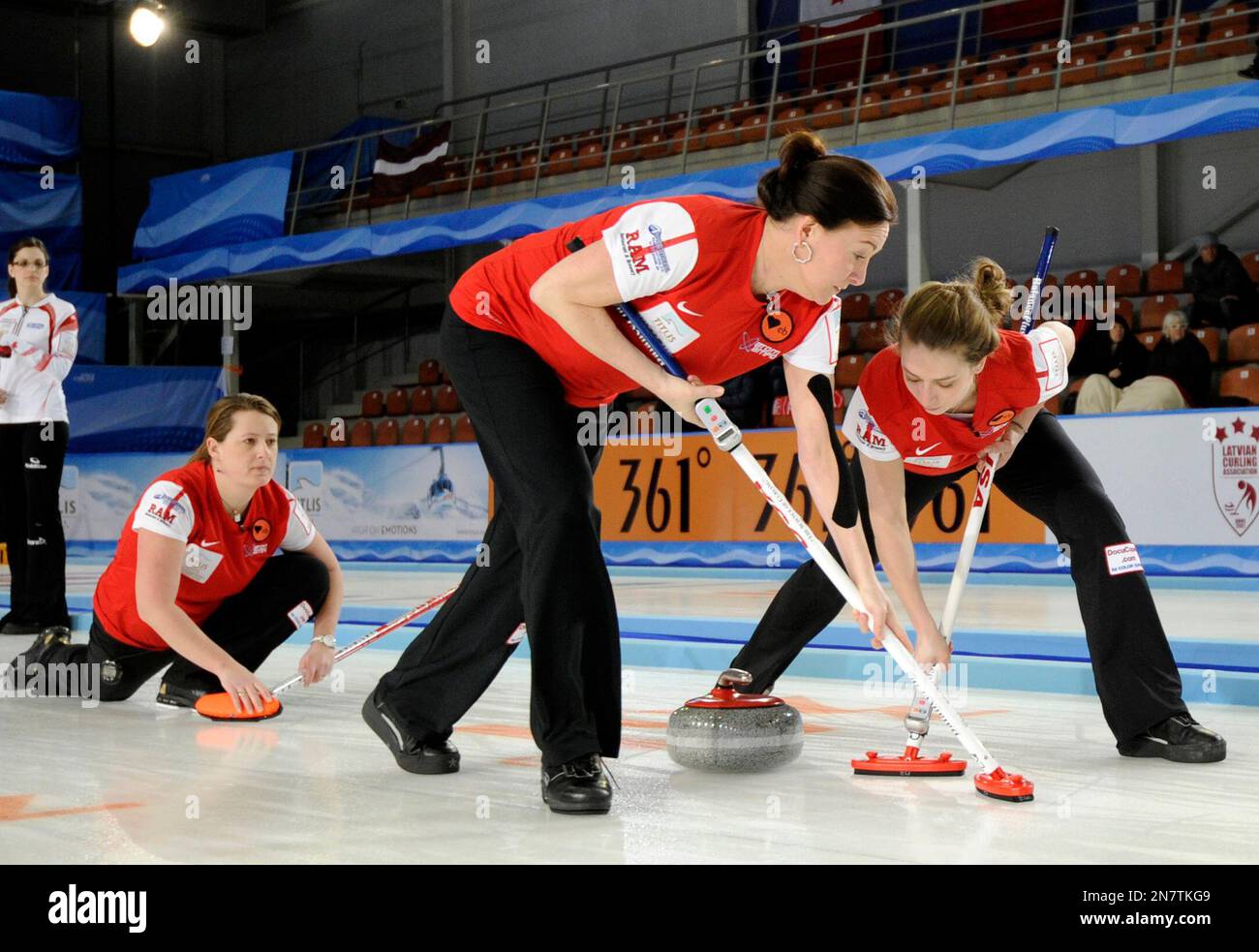 Debbie McCormick of the United States, left, delivers the stone while ...