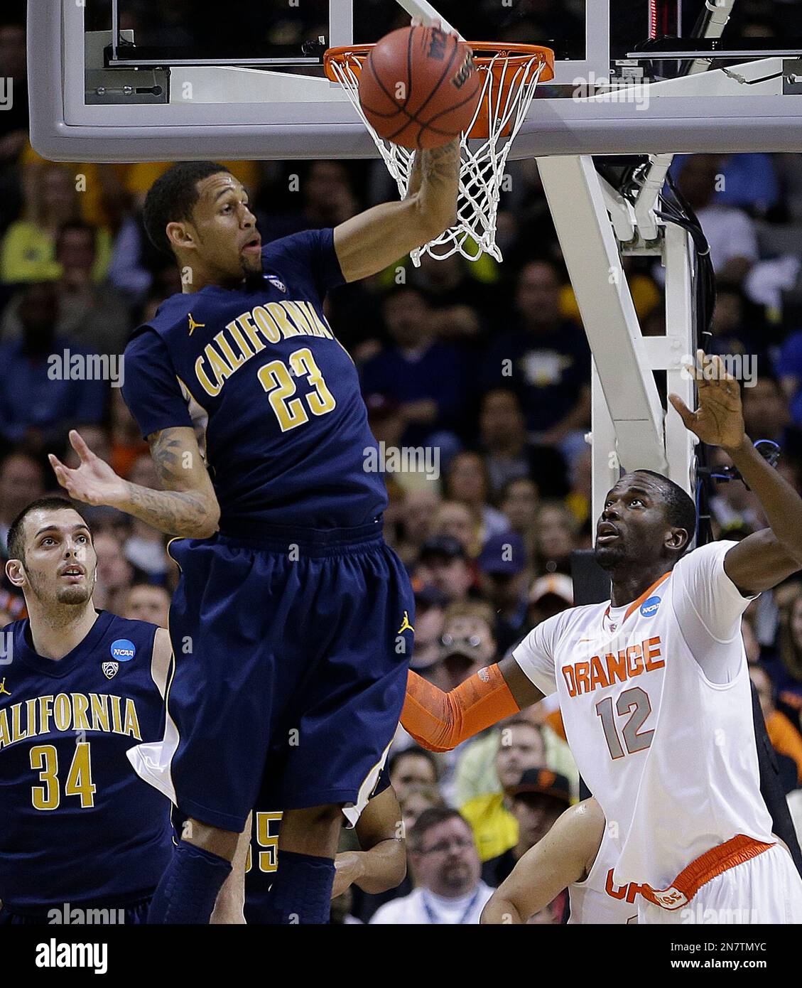 California's Allen Crabbe (23) rebounds over Syracuse forward Baye ...